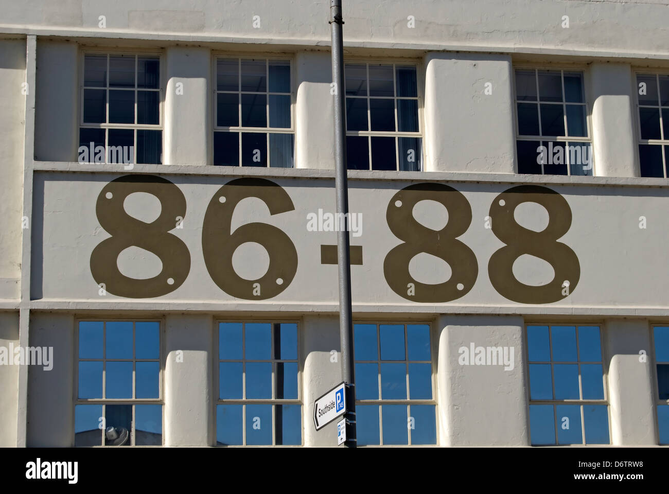 numbers 86 and 88, part of an oversized street address on a building in ...
