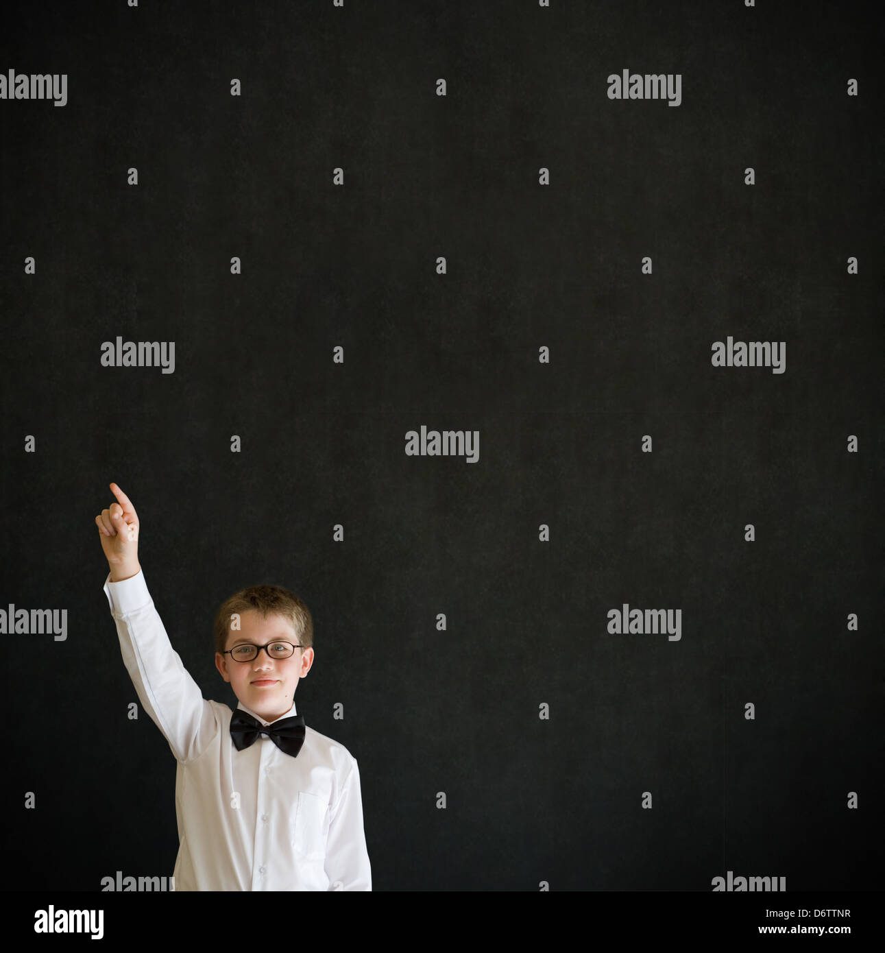 Education school boy hands up answering question on blackboard Stock ...