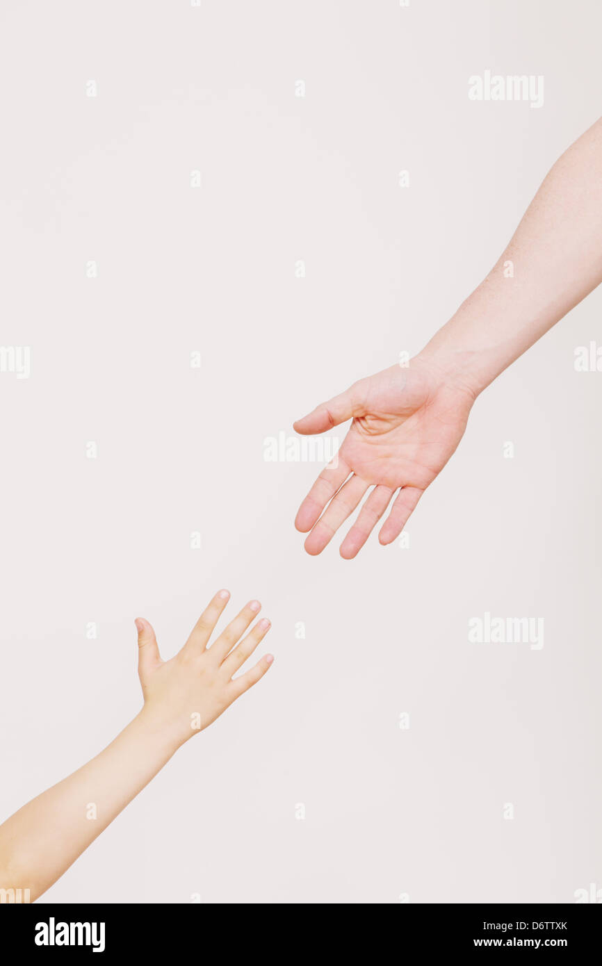 Hands reaching out Stock Photo - Alamy