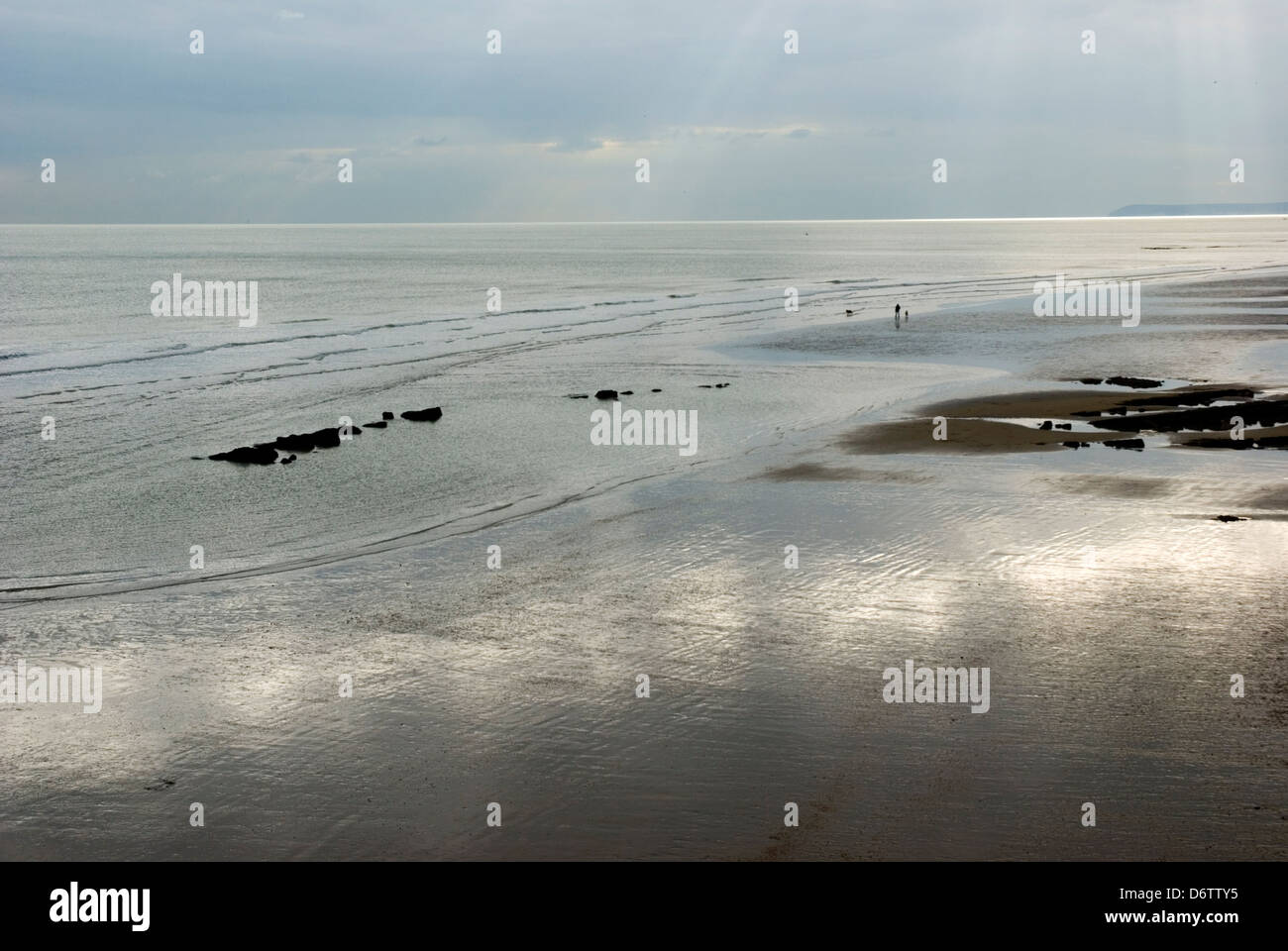 Sunshine on Hastings beach after a spring rain storm Stock Photo - Alamy