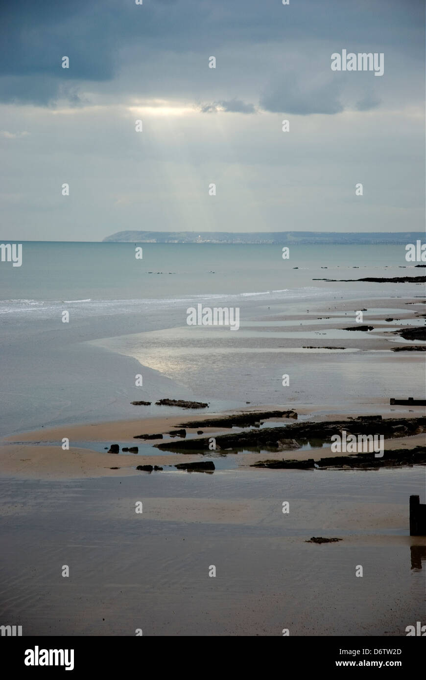 Hastings beach with sunshine creeping through after a spring rain storm ...