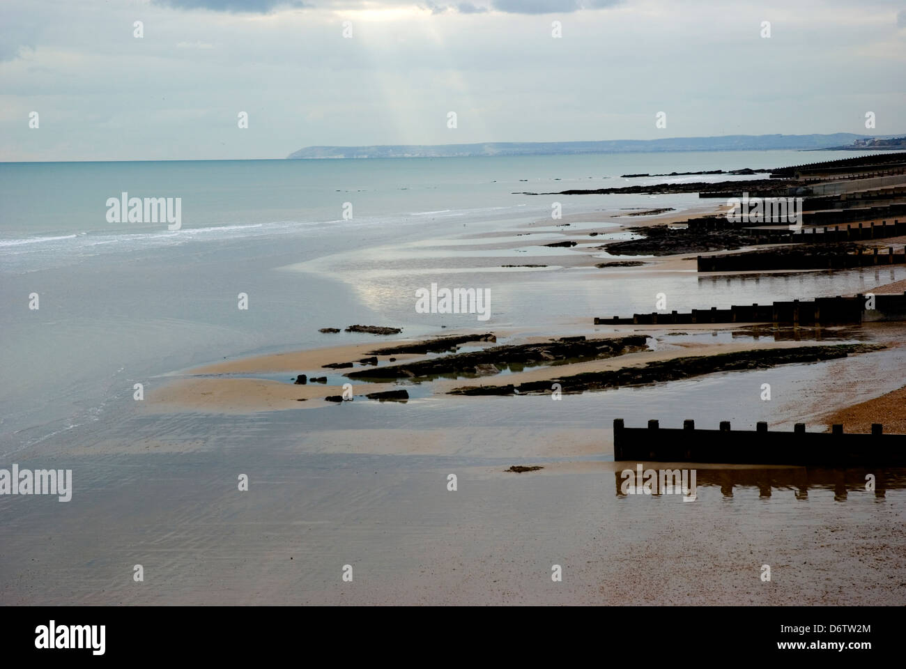 Hastings beach with sunshine creeping through after a spring rain storm ...