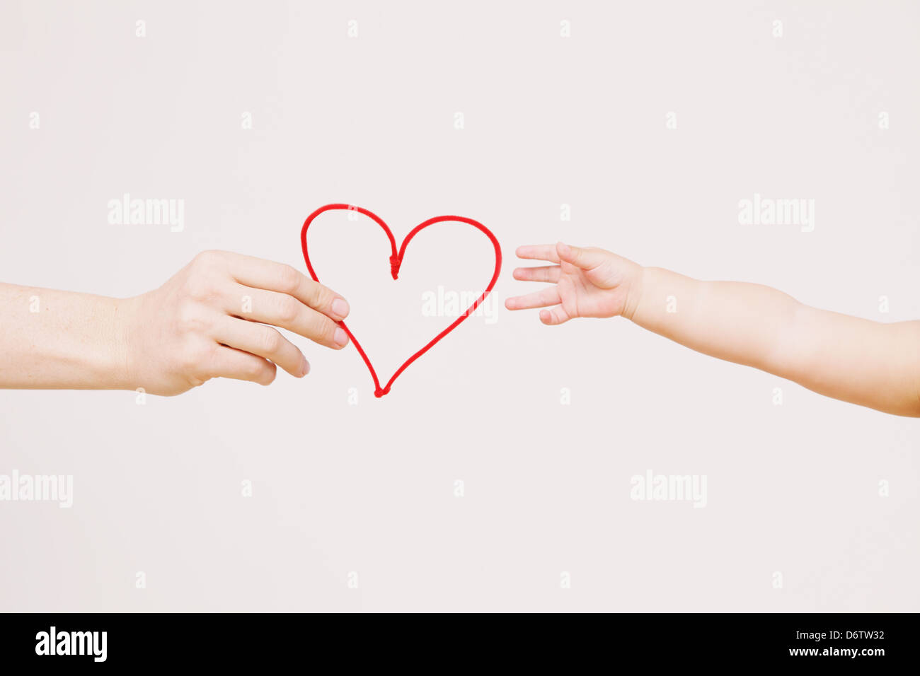 Hands and heart Stock Photo - Alamy
