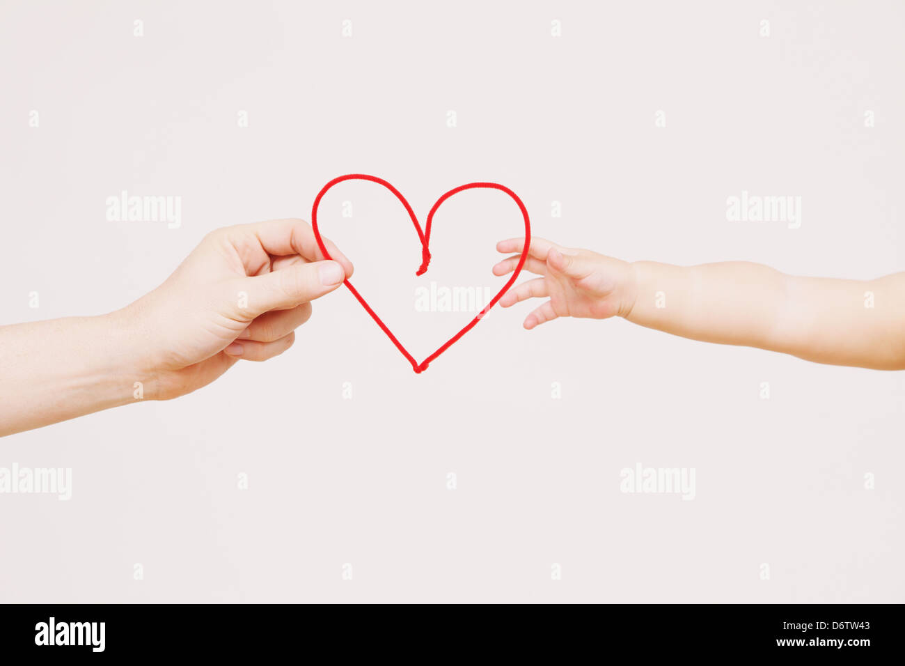 Hands and heart Stock Photo - Alamy