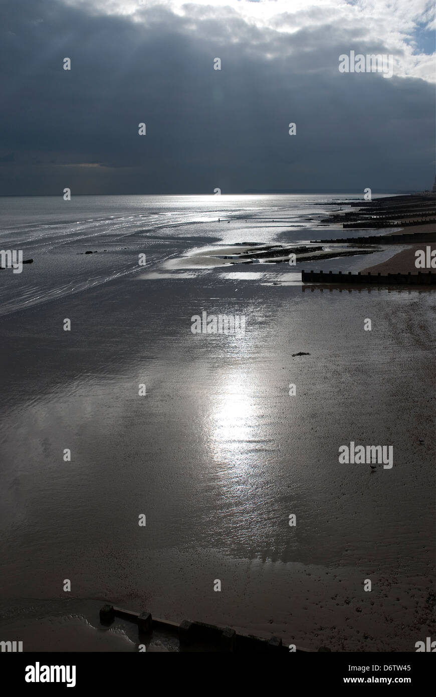 Sunshine on Hastings beach after a spring rain storm Stock Photo - Alamy