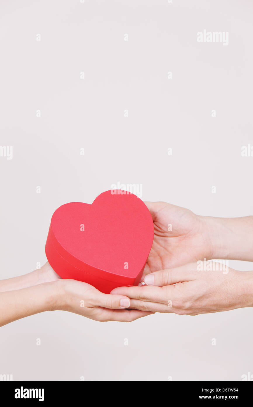 Hands and heart Stock Photo - Alamy