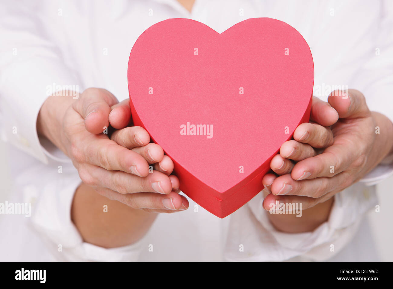 Hands and heart Stock Photo - Alamy
