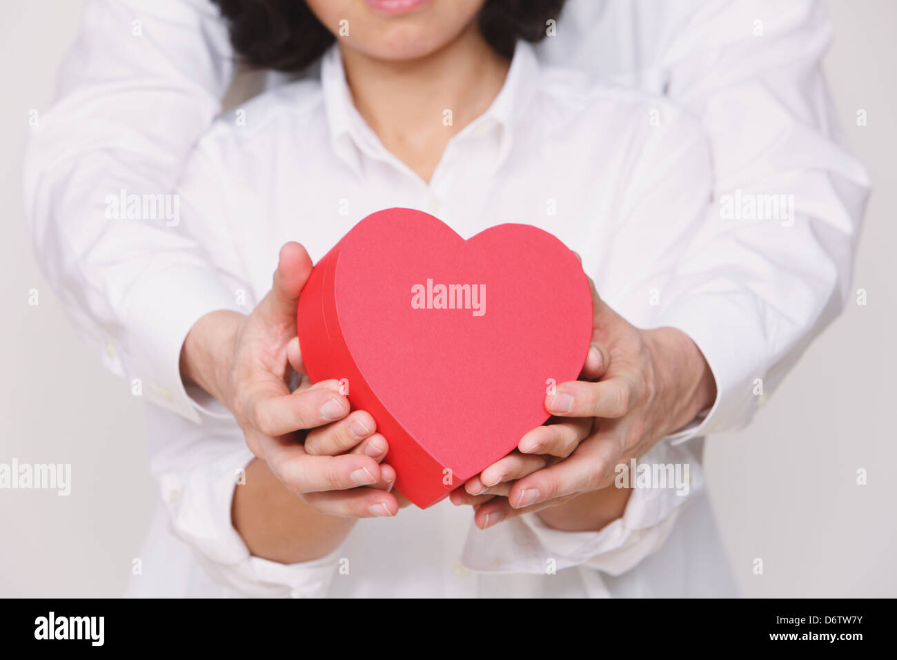Hands and heart Stock Photo - Alamy