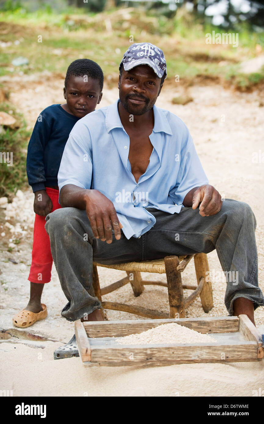 man sifting grain, Kenscoff mountains above Port au Prince, Haiti ...