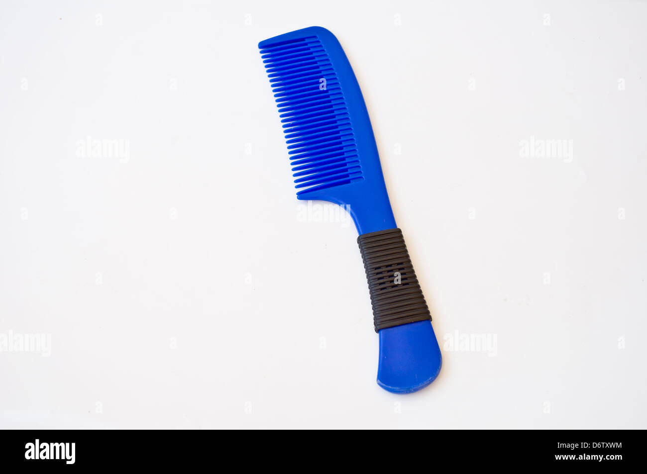 blue comb on white background Stock Photo - Alamy
