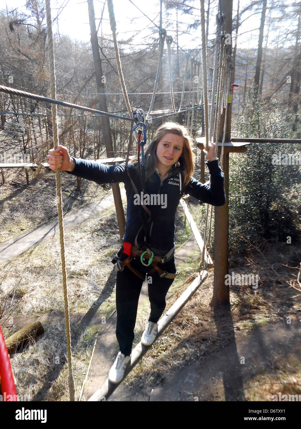 teenager on the GO Ape obstacle course at Dalby forest , england uk ...