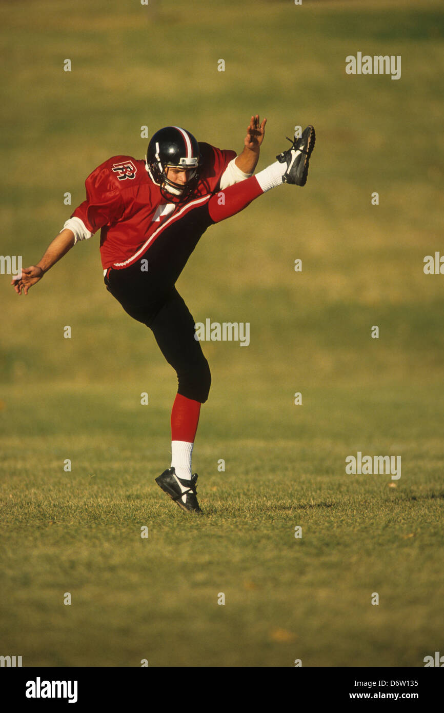 Football kicker in action Stock Photo - Alamy