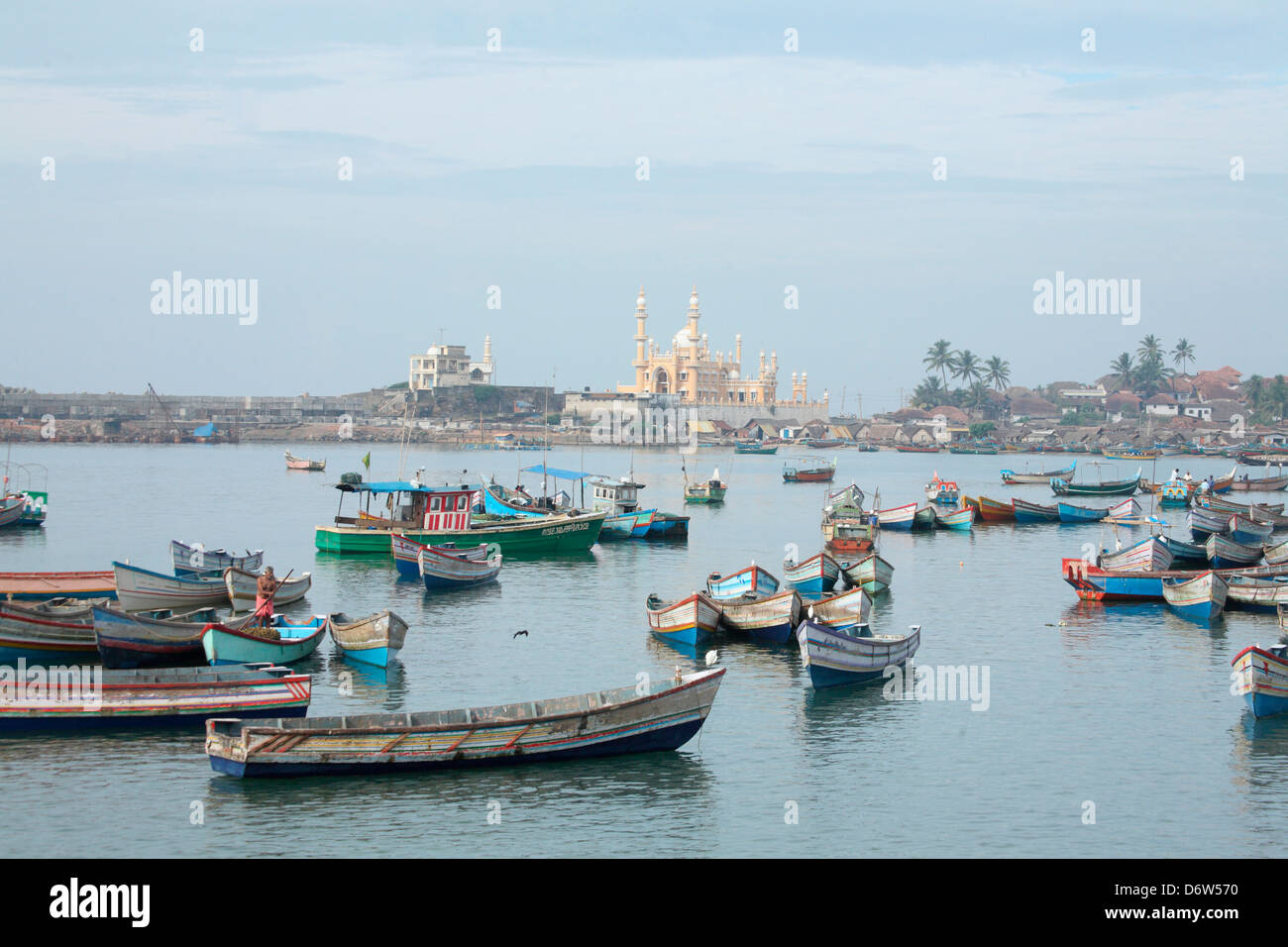 Boats in a river with a mosque in the background, Vizhinjam Mosque ...