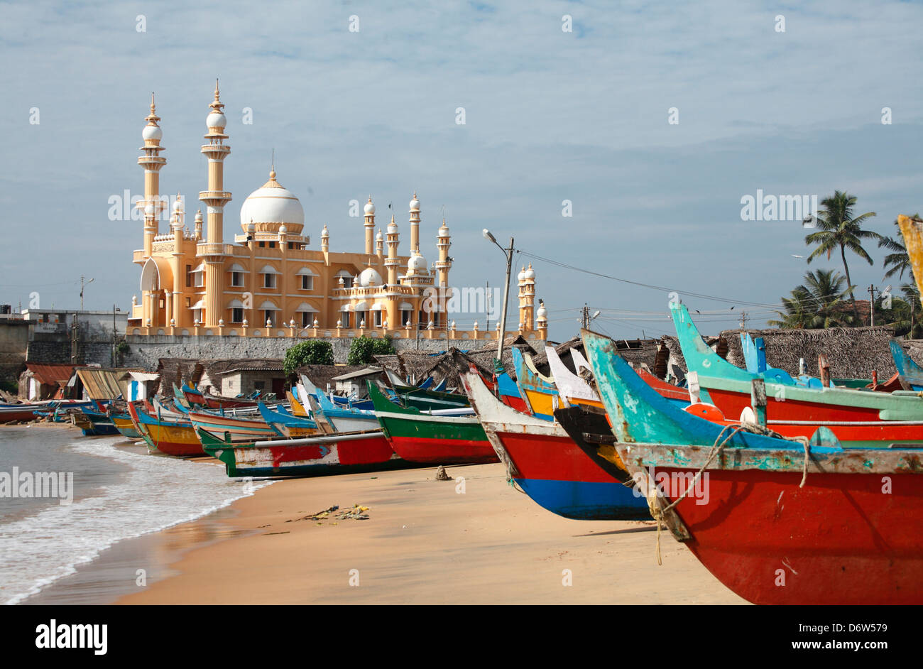 Fishing boats with a mosque in the background, Vizhinjam Mosque ...