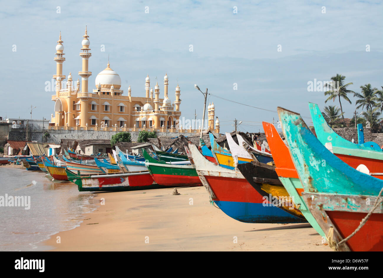 Fishing boats with a mosque in the background, Vizhinjam Mosque ...
