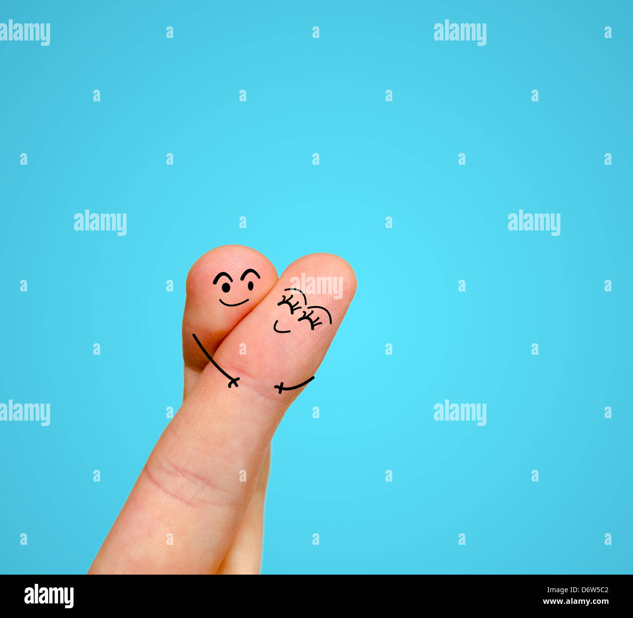 A happy fingers couple in love with painted smiley and hugging Stock ...