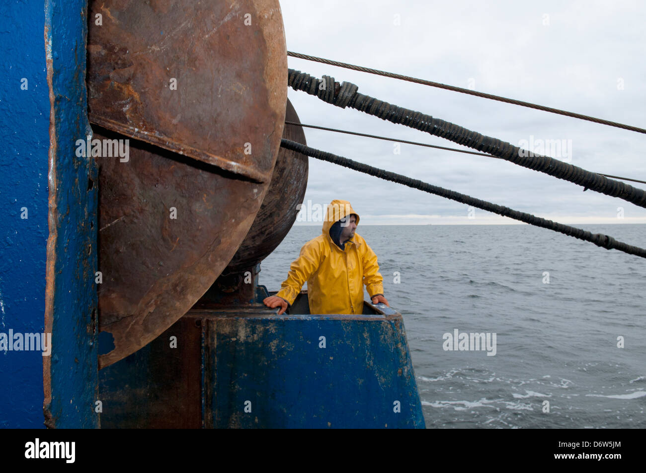 Fisherman hauling back dragger net on fishing trawler. Stellwagen Banks ...