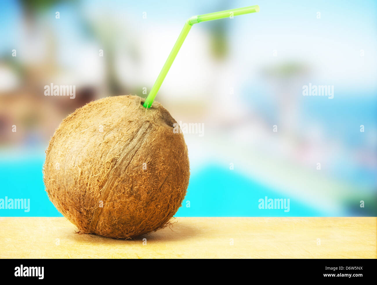 Coconut with straw Stock Photo - Alamy