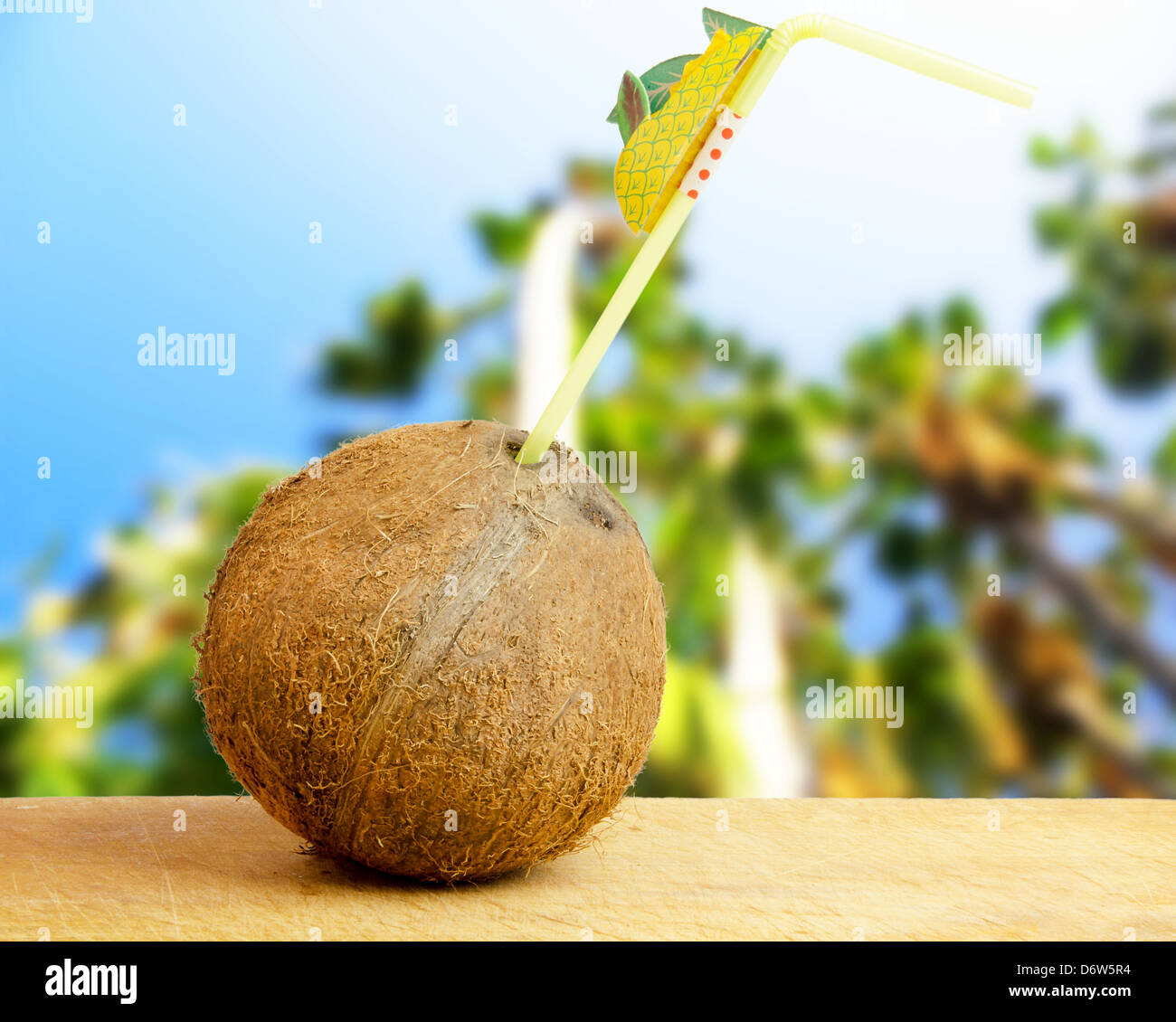 Coconut with straw Stock Photo - Alamy