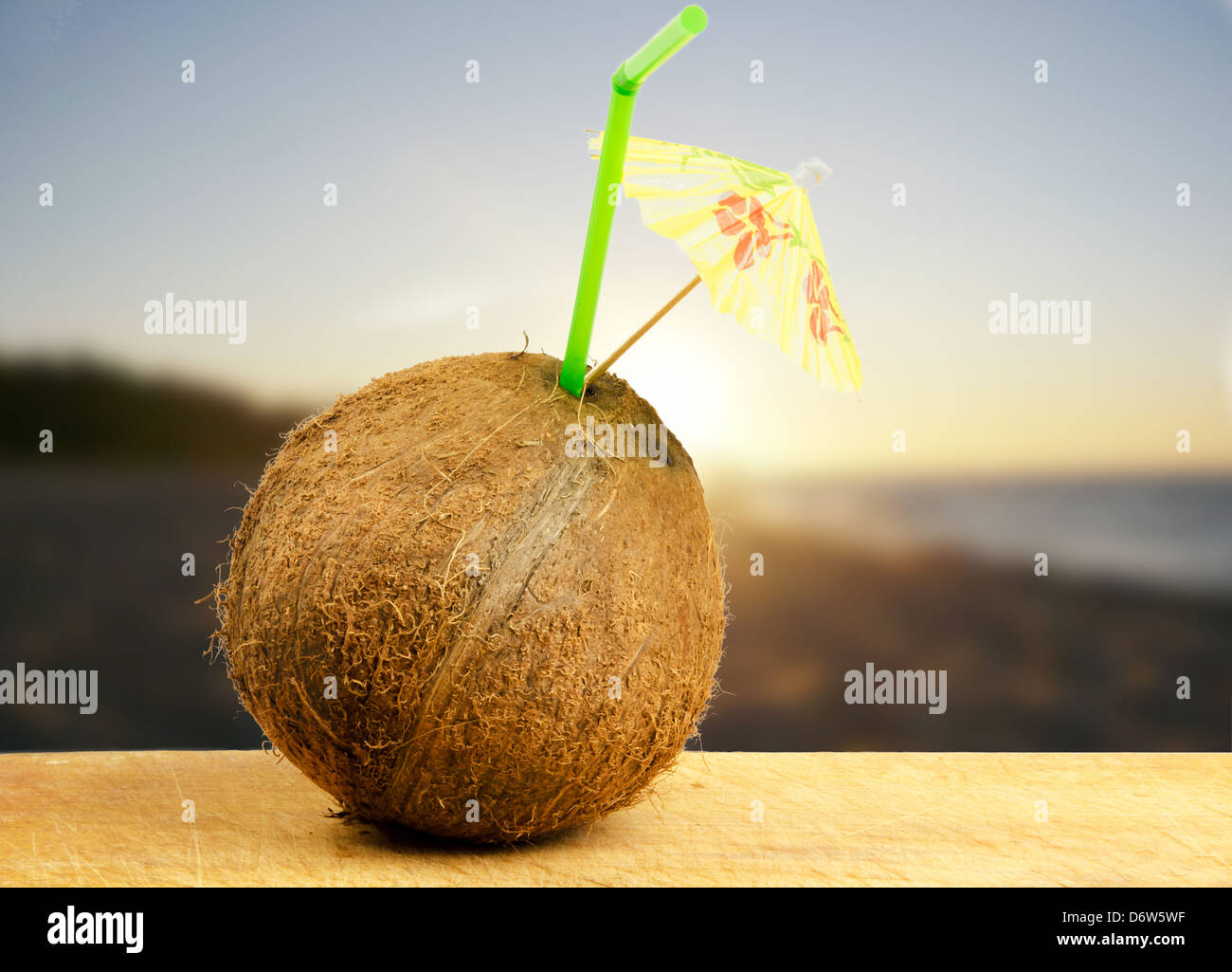 Coconut with straw Stock Photo - Alamy