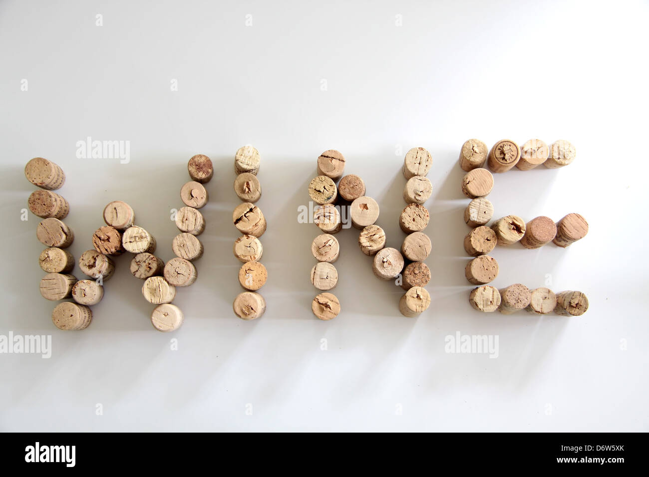 Corks forming the word wine on white background Stock Photo - Alamy