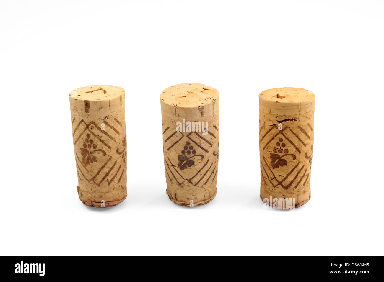 Three isolated corks with white background Stock Photo - Alamy