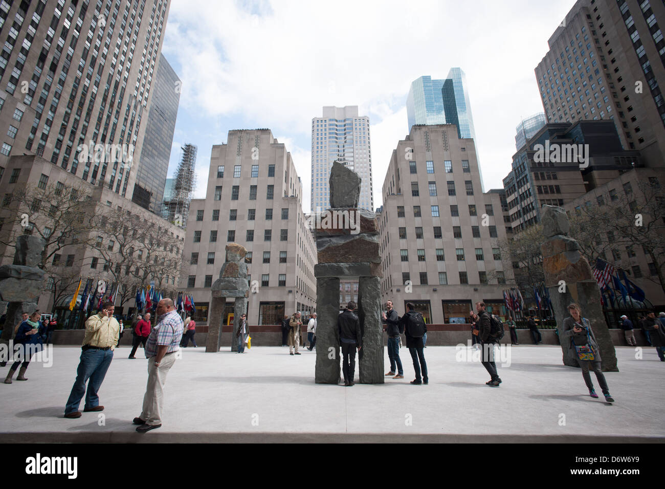 Visitors to Rockefeller Center walk amongst the "Human Nature ...