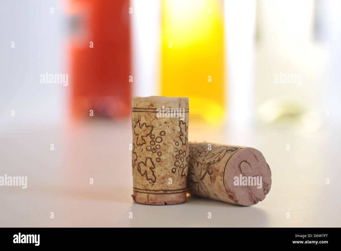 Two Corks with three colored wine bottles Stock Photo - Alamy