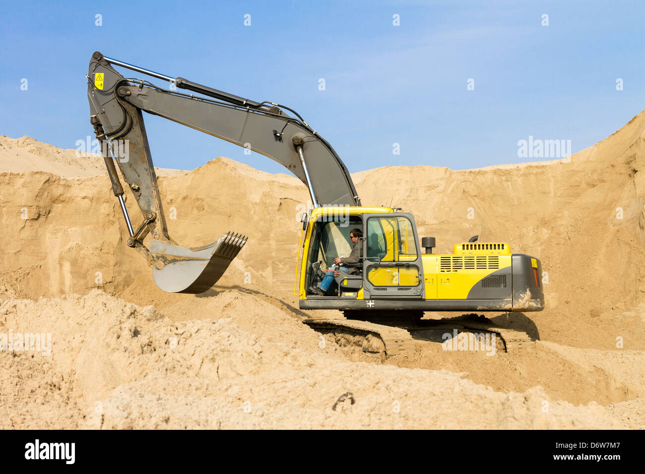 Yellow Excavator at Construction Site Stock Photo - Alamy