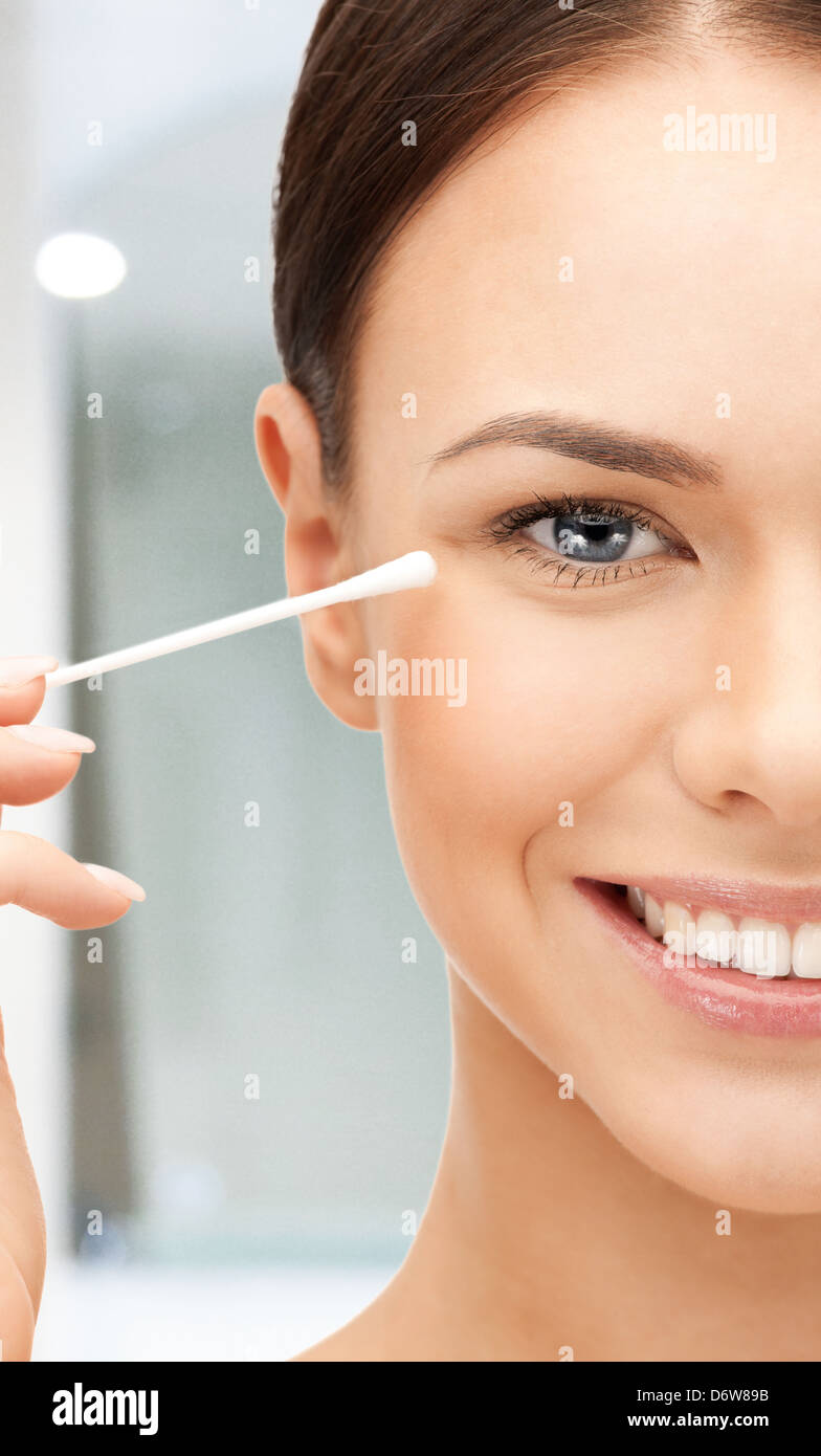 beautiful woman with cotton bud Stock Photo - Alamy