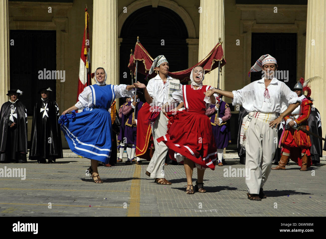 Actors dressed in traditional garment take part in the the traditional ...