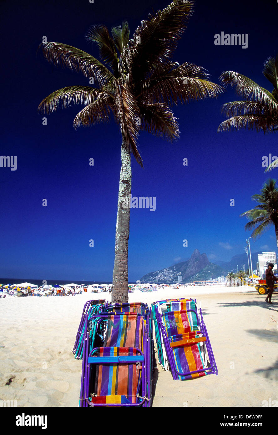 Brazil, Rio De Janeiro, Ipanema, Beach chairs under palm tree Stock ...