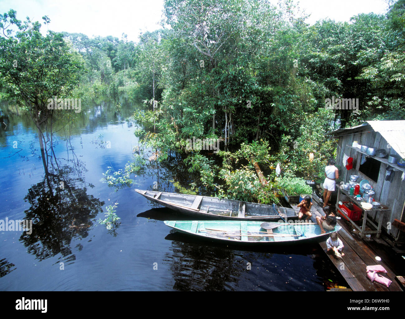 Brazil, Amazon River, Local People outside of their wooden house Stock ...