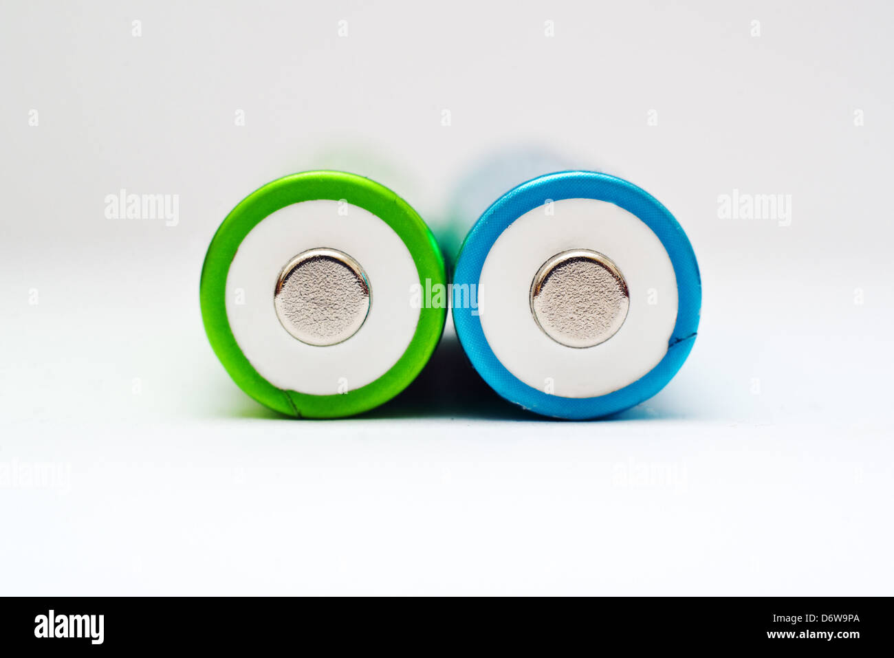 AA batteries. Green and blue AA batteries close up Stock Photo - Alamy