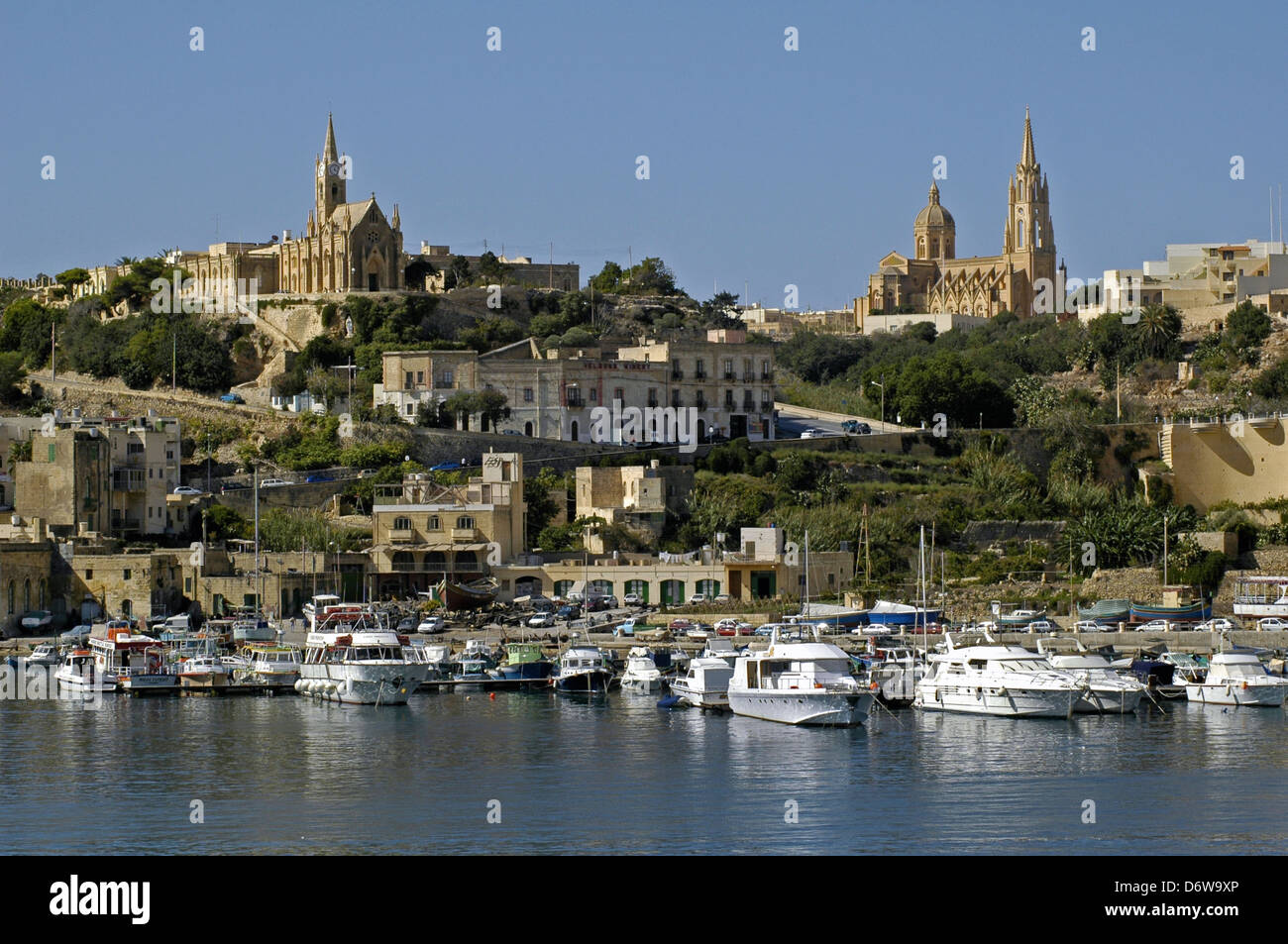 Our Lady of Lourdes church and Ghajnsielem Parish Church overlooking ...