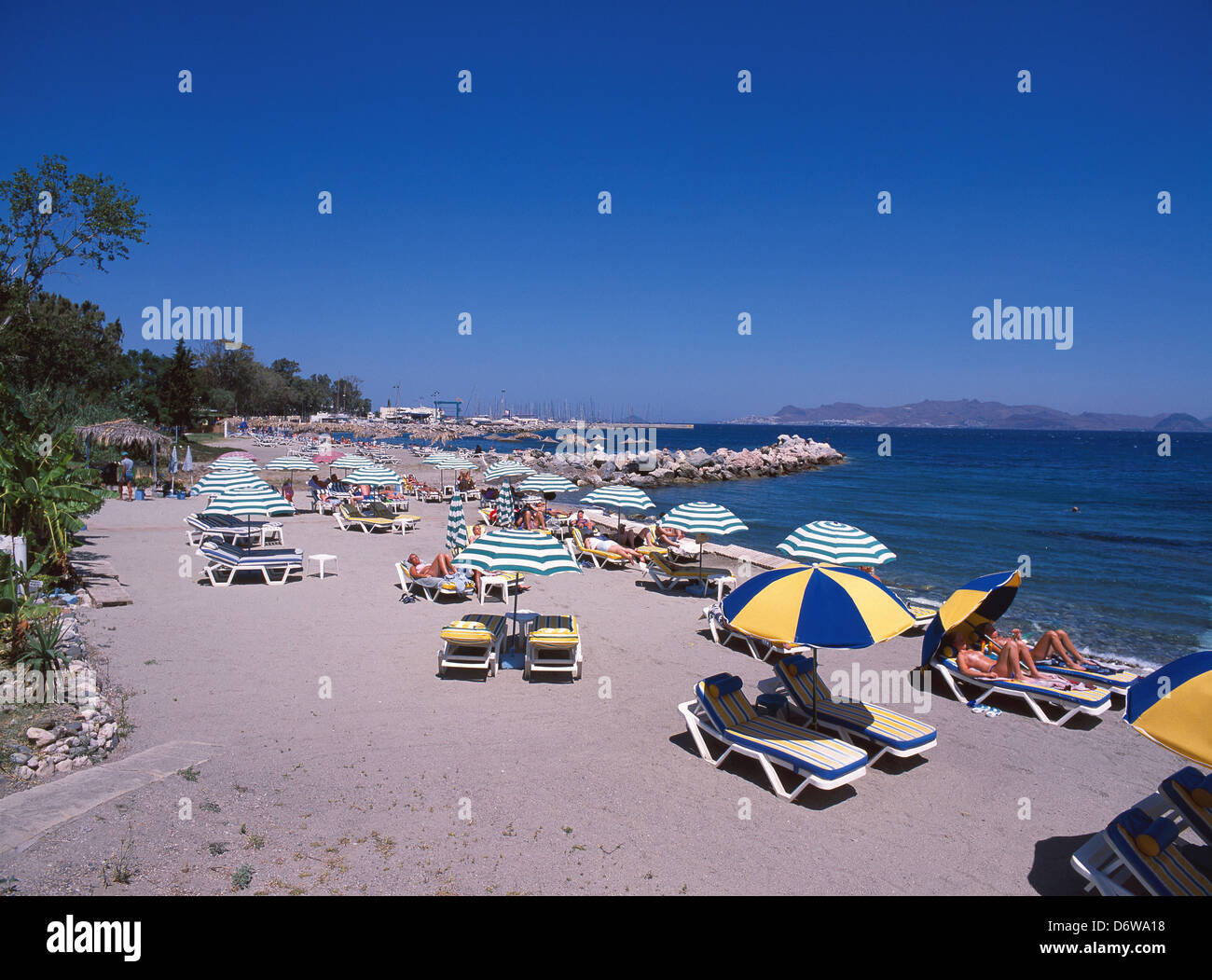 Greece, Kos Island, Psalidi, People relaxing on beach Stock Photo - Alamy