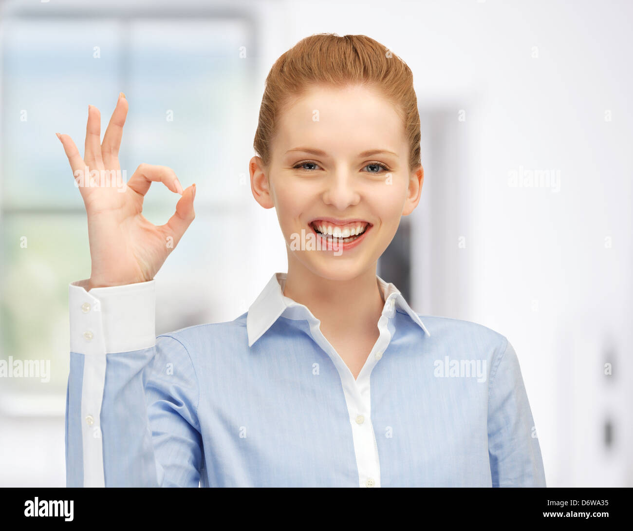 young woman showing ok sign Stock Photo - Alamy