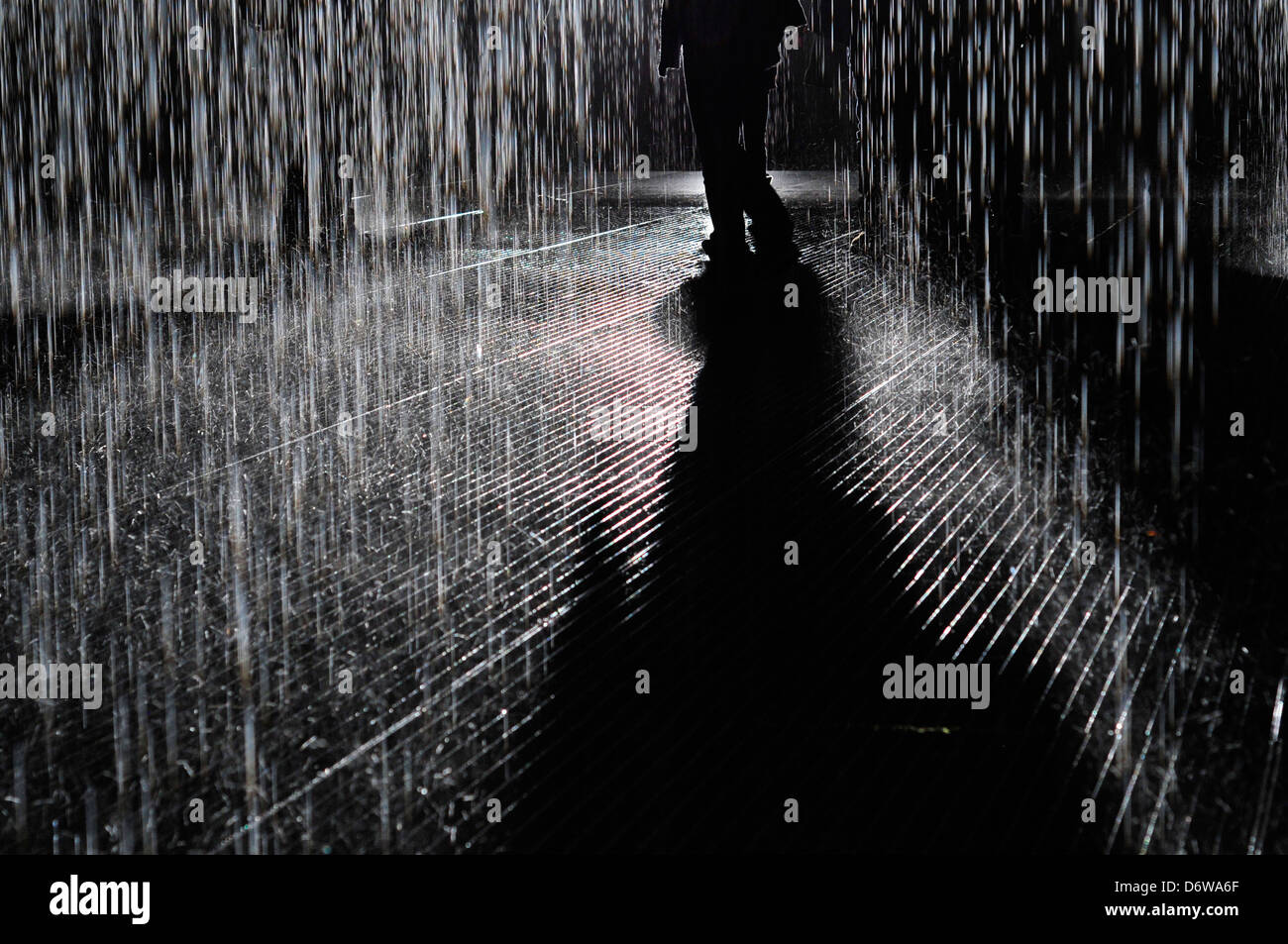 A long shadow of a man in the " rain room" at the Barbican centre Stock ...