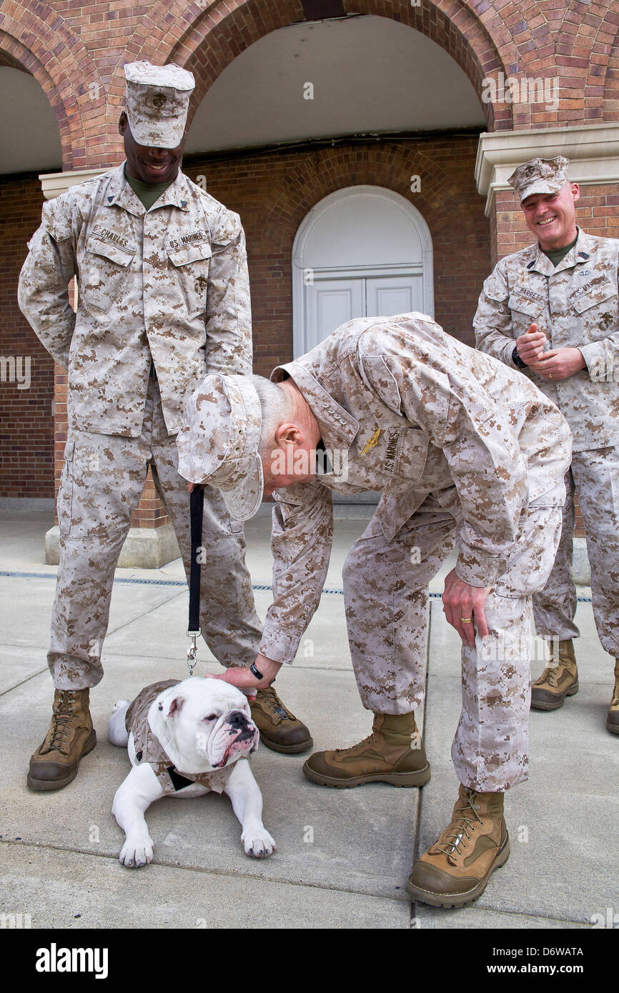 Commandant of the US Marine Corps Gen. James F. Amos pets outgoing ...