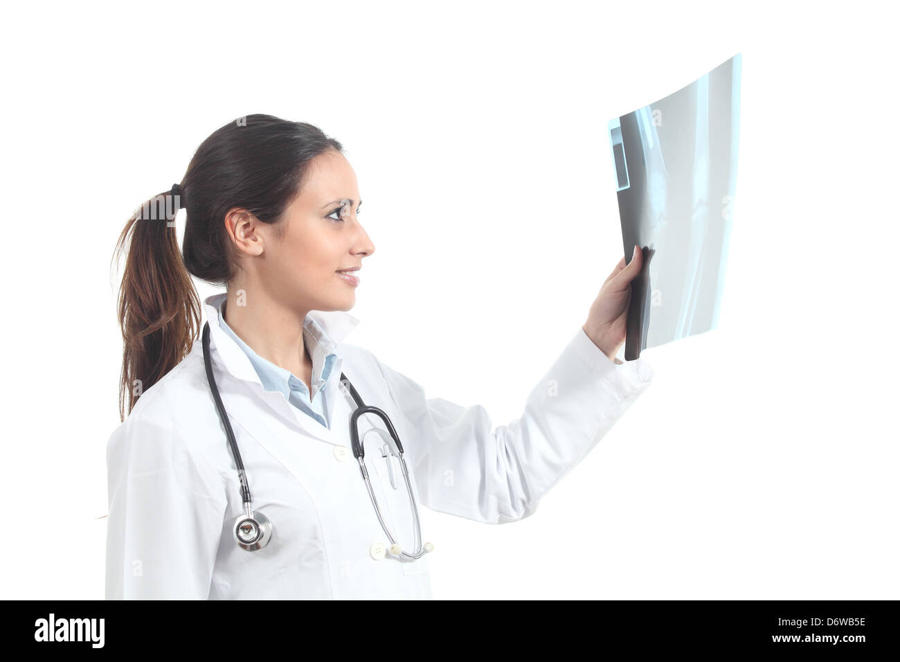 Beautiful female doctor watching a radiography on a white isolated ...