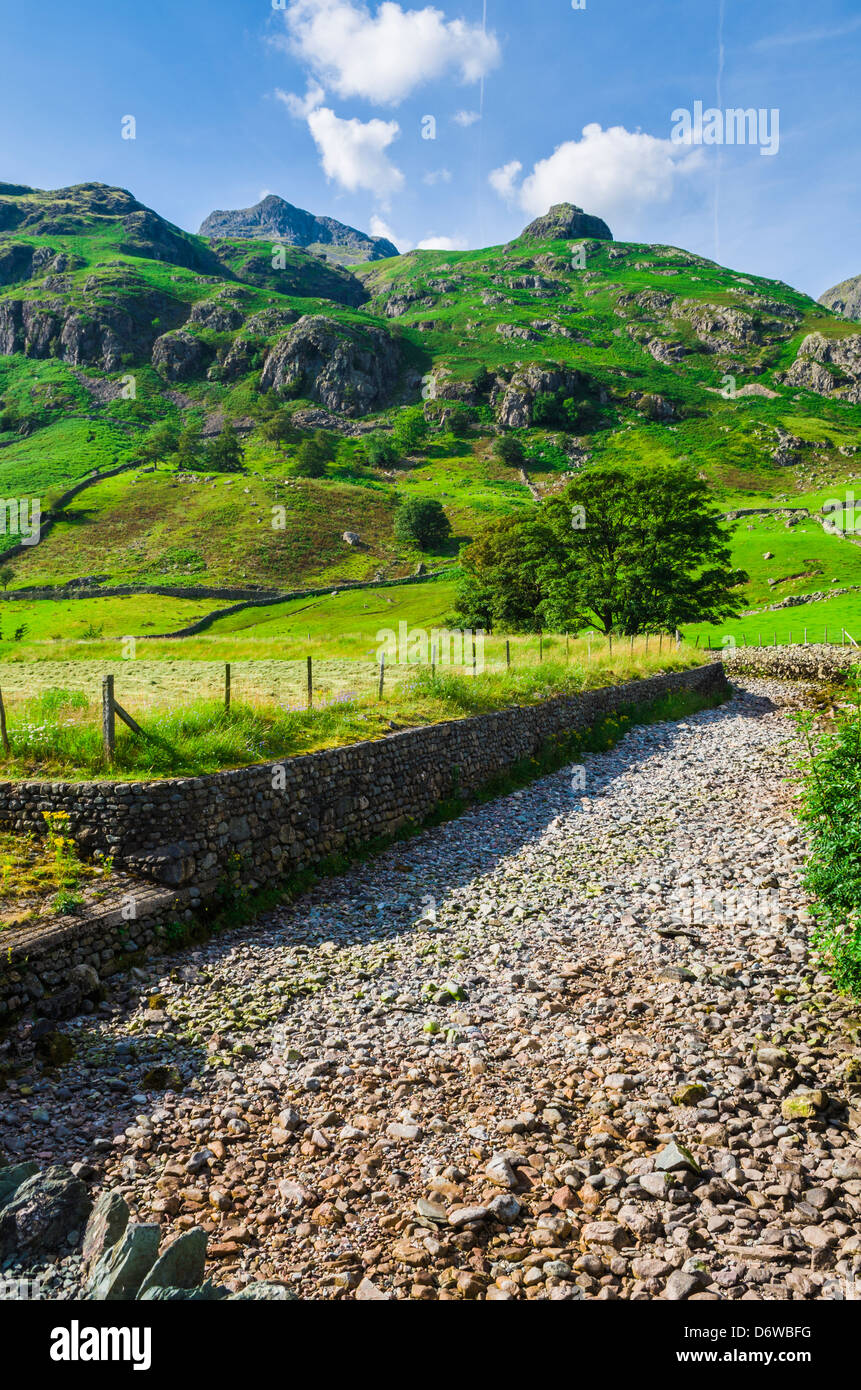 The dried-up riverbed of Great Langdale Beck during a drought. Lake ...