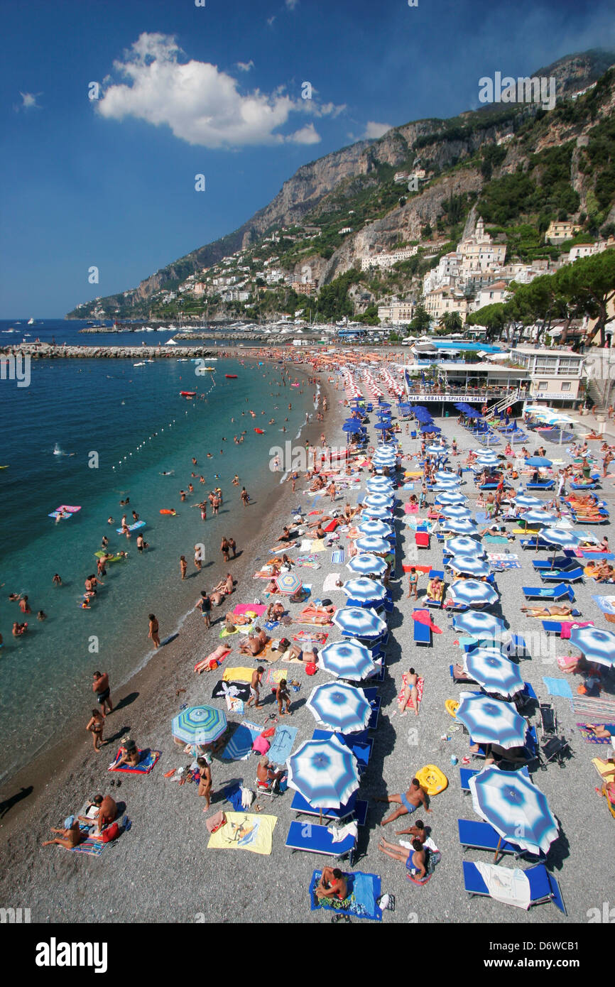 Italy, Neapolitan Riviera, Amalfi, people sunbathing on beach Stock ...