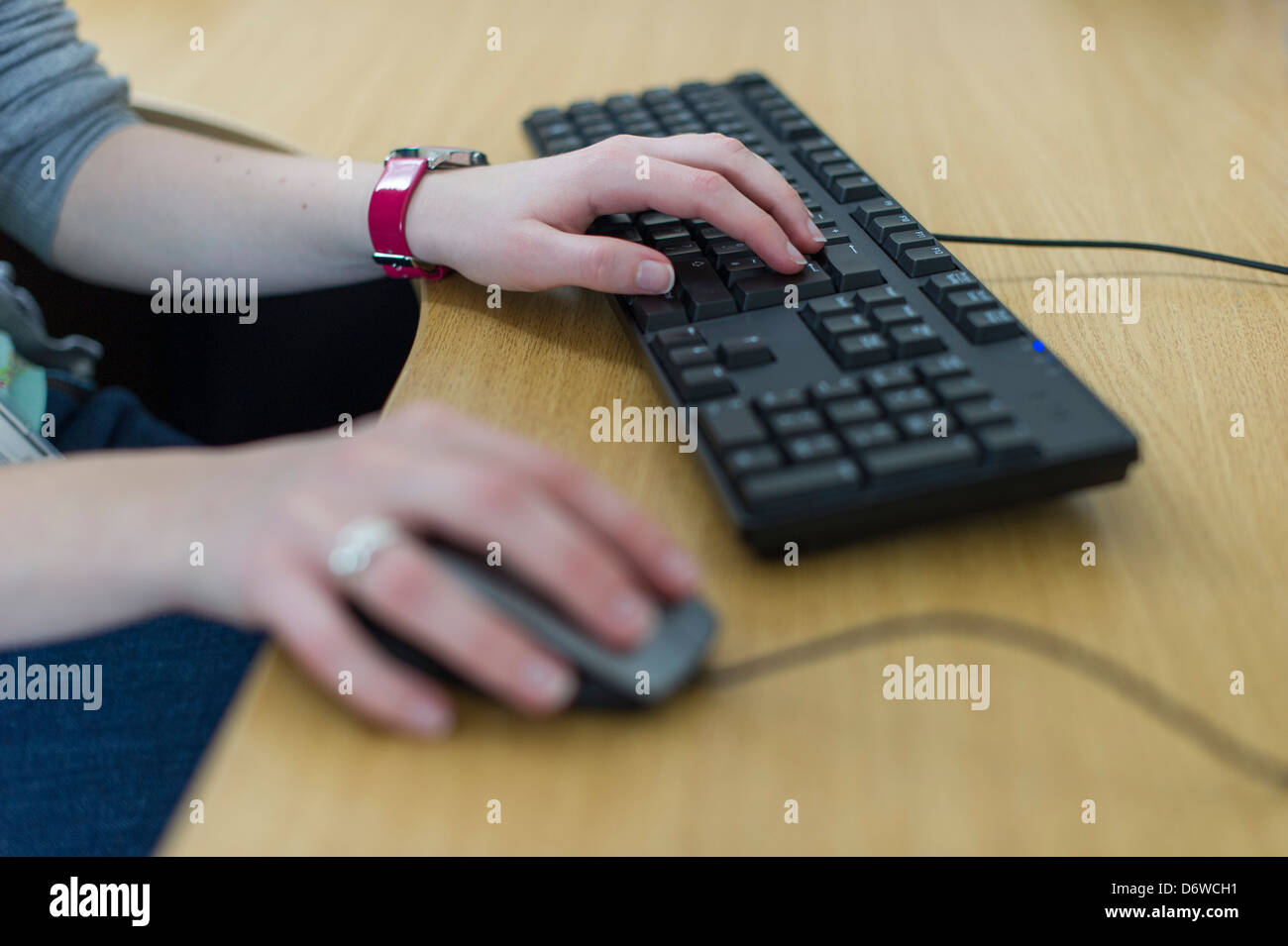 hands using a mouse and keyboard on a computer Stock Photo - Alamy