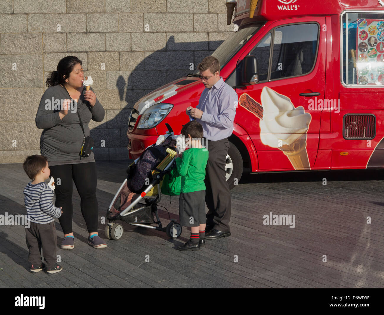 Family enjoying ice-cream from a van in the streets of London, UK Stock ...
