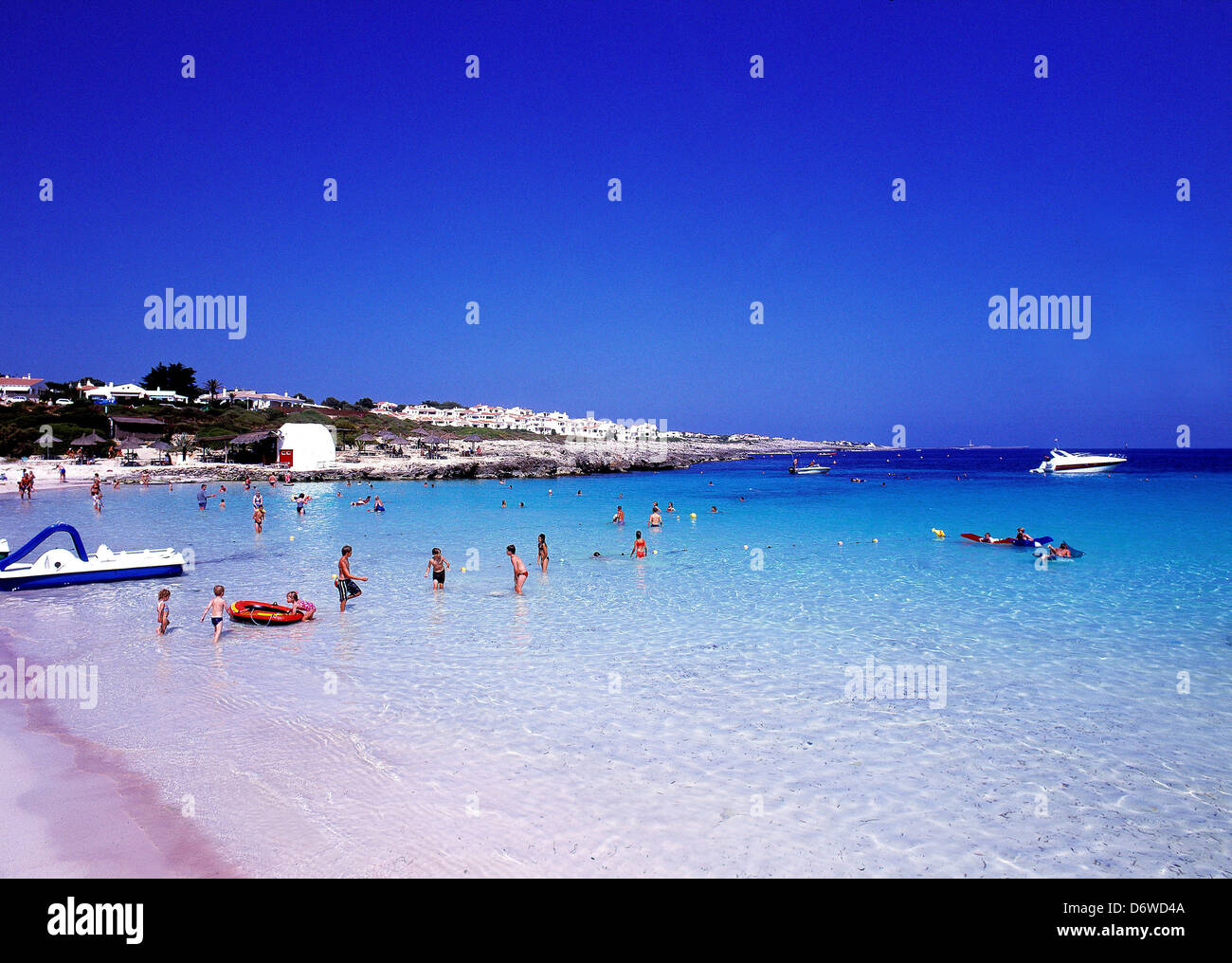Spain, Minorca, Binibeca, People relaxing on beach Stock Photo - Alamy