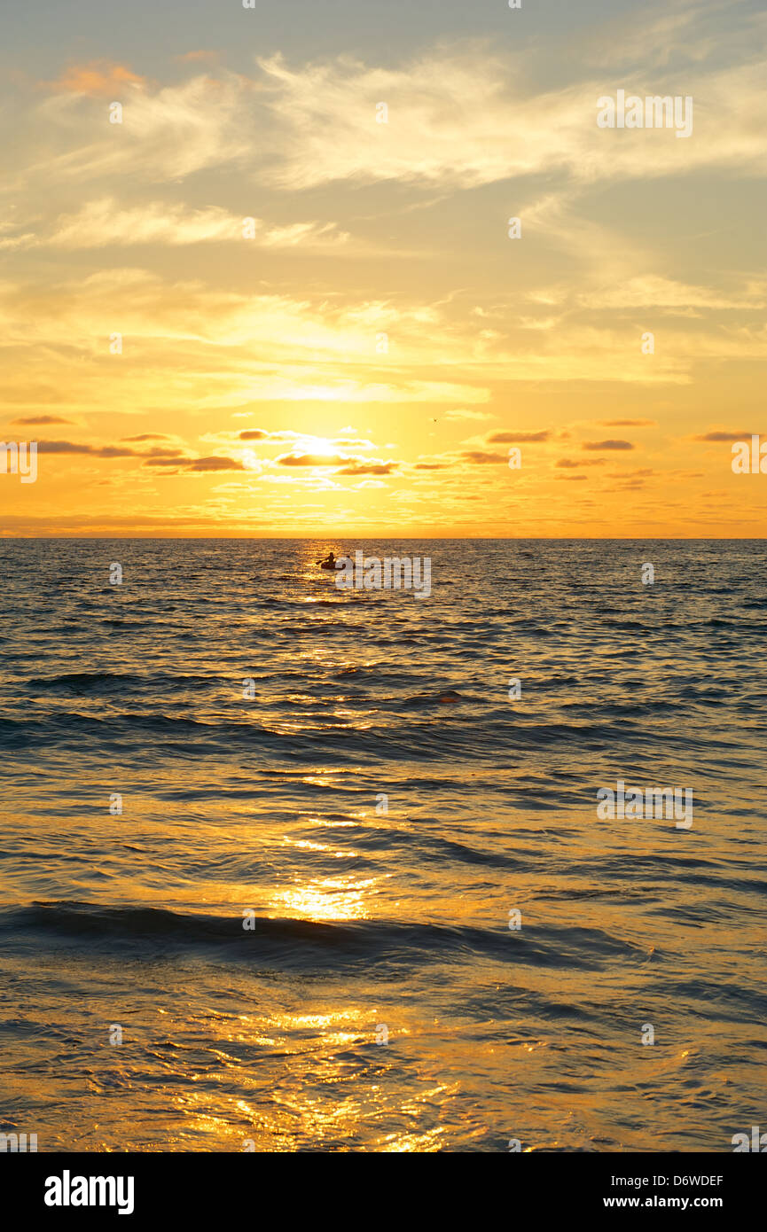 Vertical photo of a small water craft or boat on the waters of the ...
