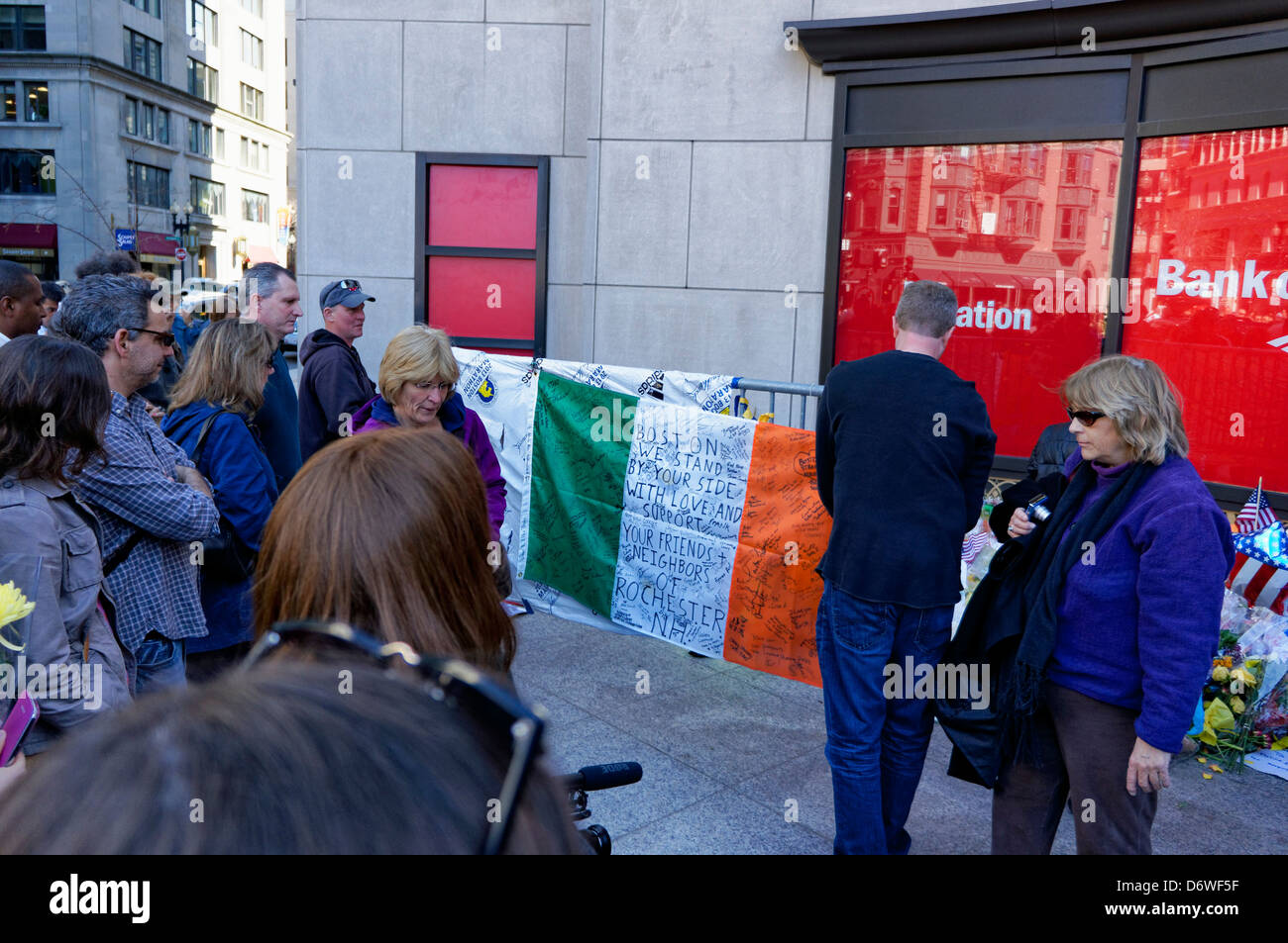 Men moving barricade with signatures from Boston bombing memorial Stock ...