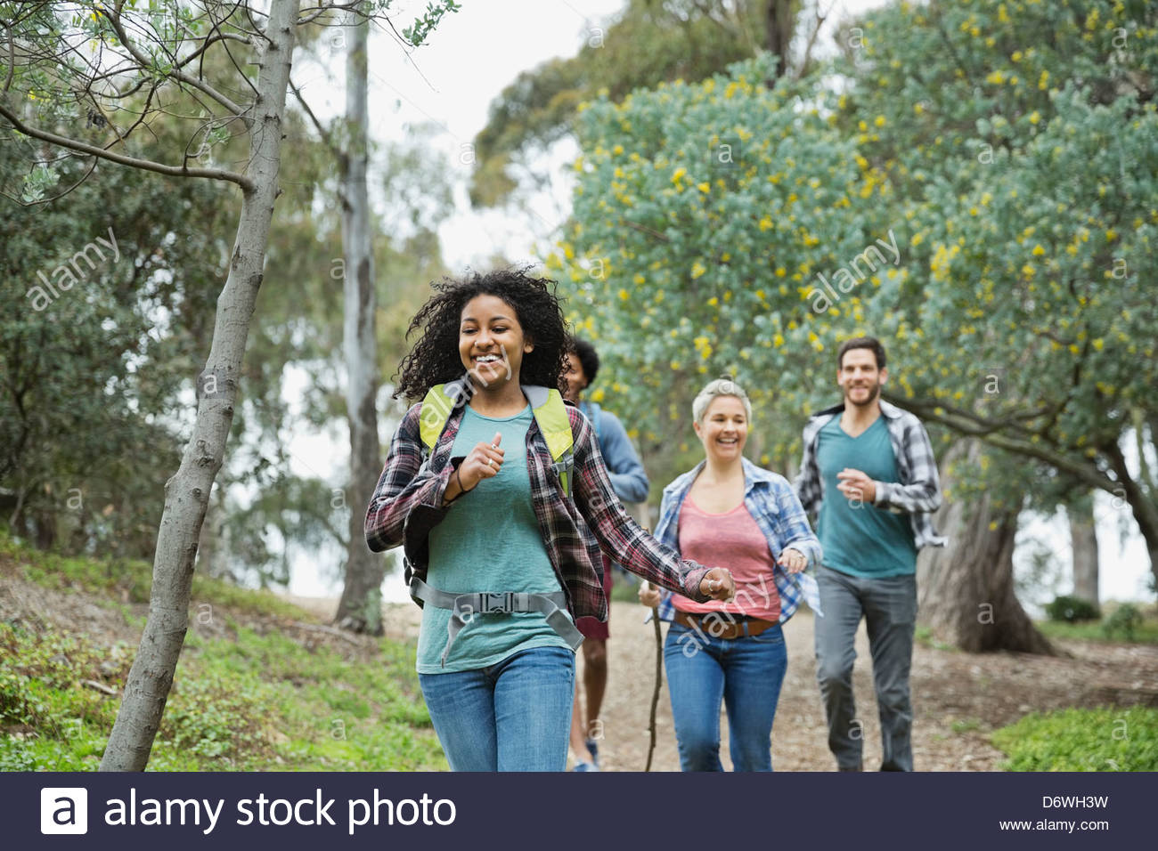 Running happy group hi-res stock photography and images - Alamy