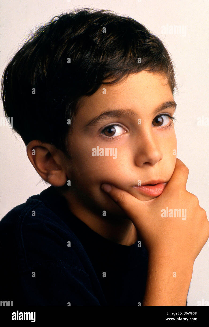 Close-up of a boy thinking Stock Photo - Alamy