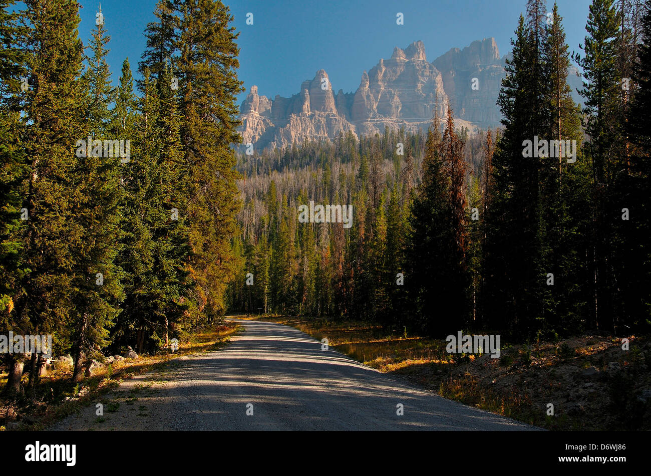 USA, Wyoming, View of Rocky Mountains above remote road Stock Photo - Alamy
